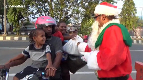 Environmental Claus: Indonesian Santa gives out gifts to combat climate ...