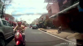 Distracted motorcycle rider playing phone crashes into back of car ...
