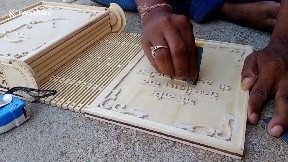 Indian artist creates wooden Hindu scripture by carving out each letter ...