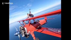 Daredevil Washington man stands on top of flying airplane while it ...