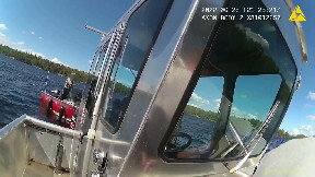 Park ranger Steve Pederson chokes a local business owner Justin Ebel ...